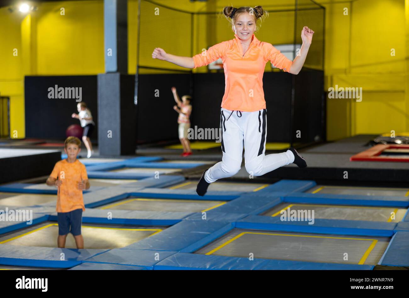 Girl on trampoline indoor hi-res stock photography and images - Alamy