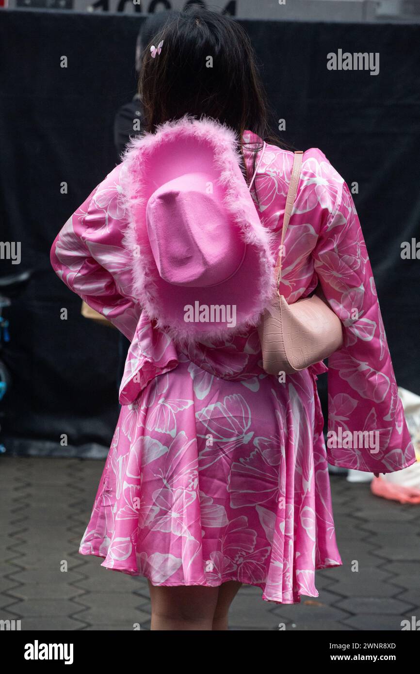 3 March 2024. Backview of a female fan dress in pink for Taylor Swift ...