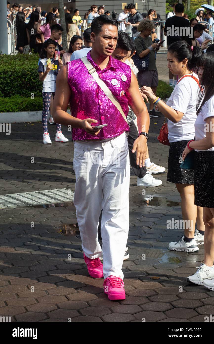 3 March 2024. A Swifties male fan dress in pink top and pink sneakers ...
