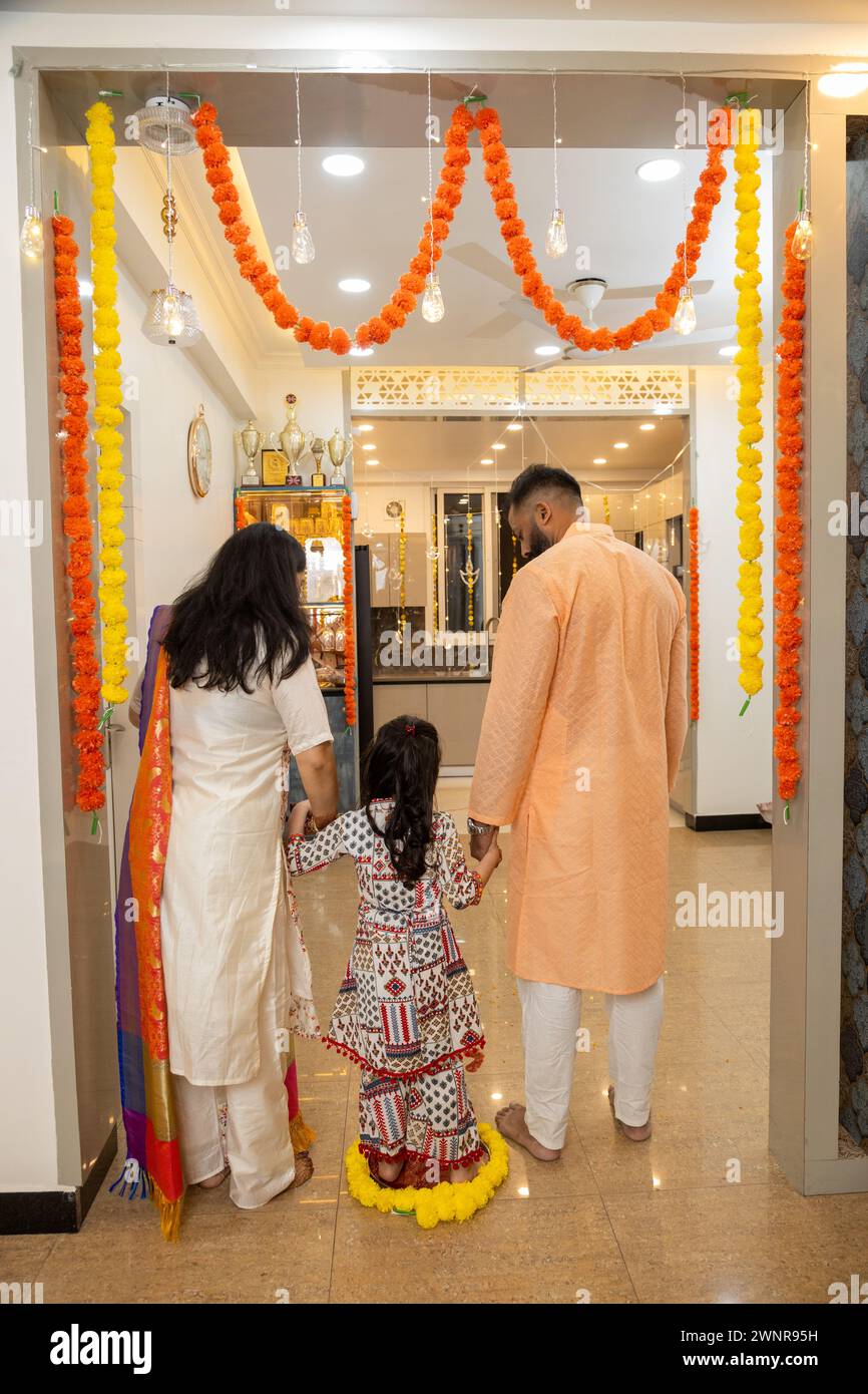 Happy Indian Family With House