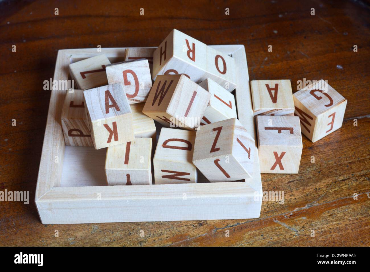 Wooden blocks with numbers and letters to train children to learn motor ...
