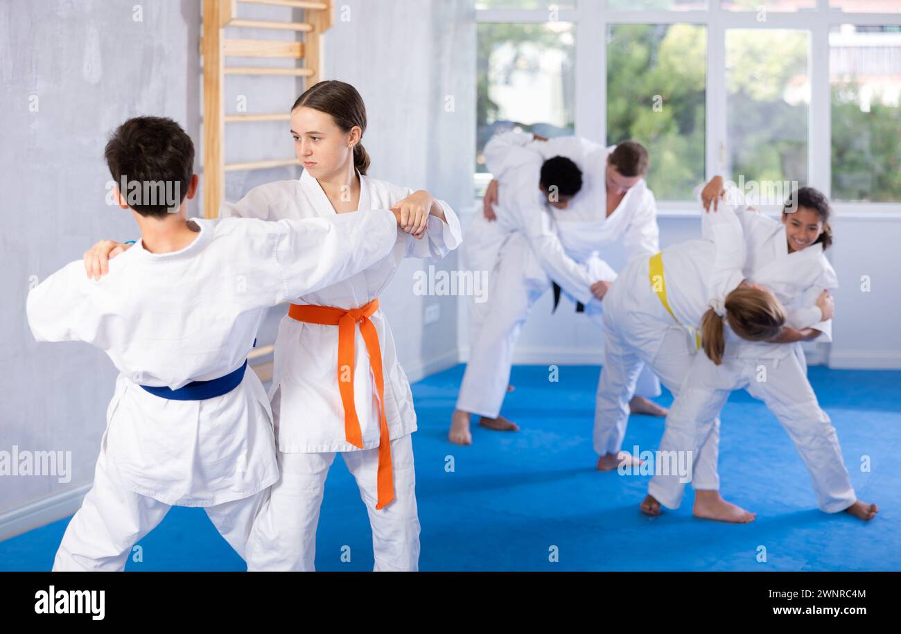 Boy and girl training judo technique Stock Photo - Alamy