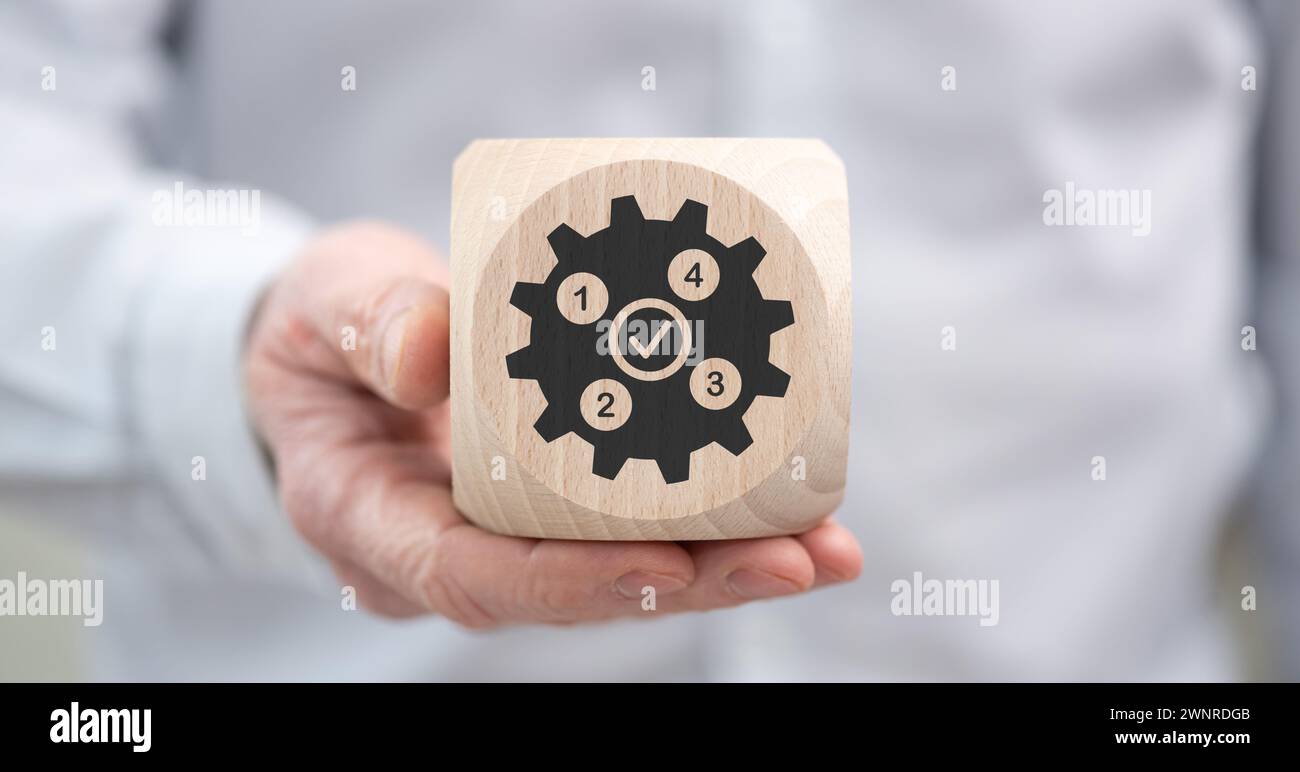 Hand holding a wooden cube with symbol of action plan concept Stock ...