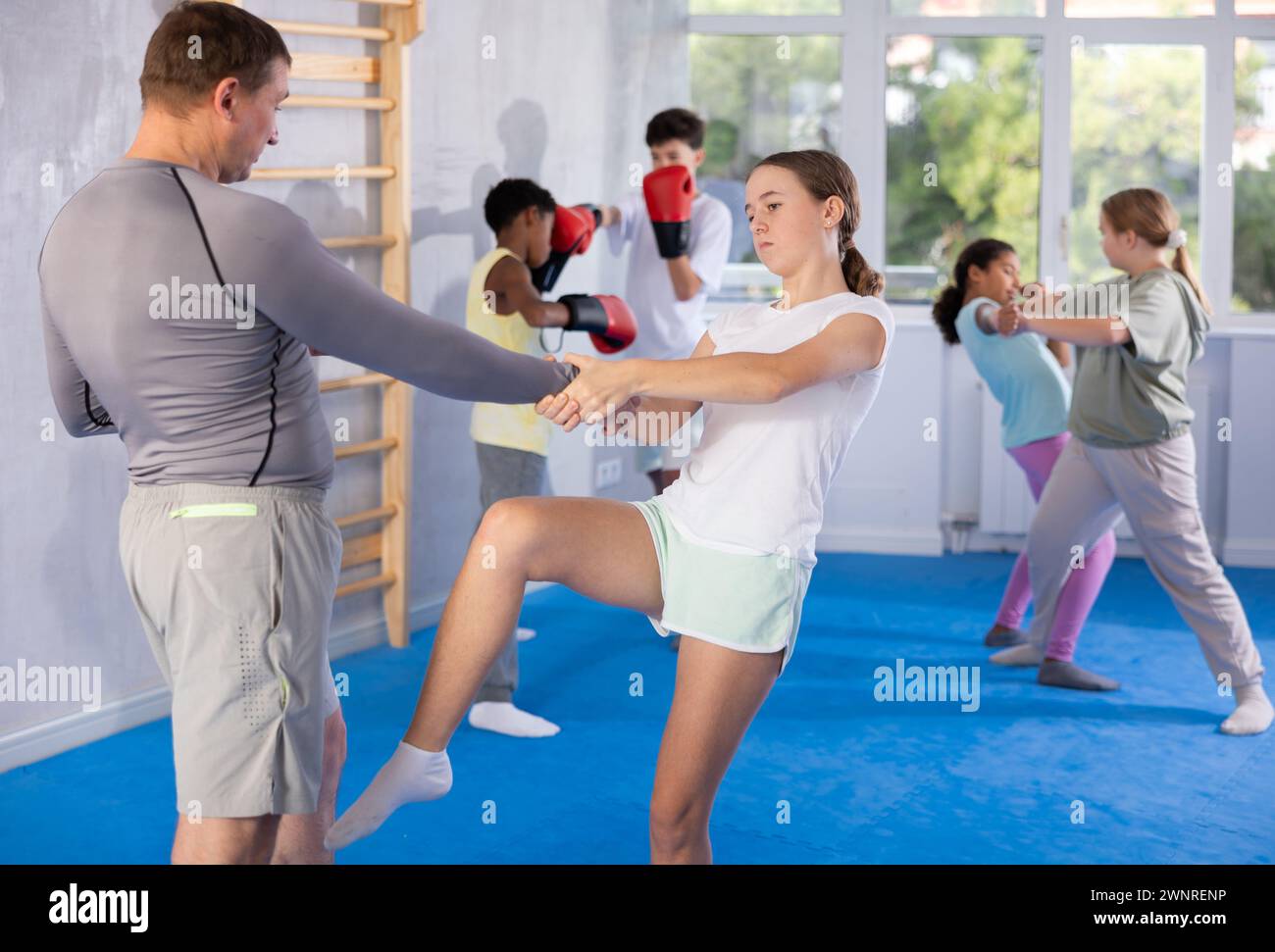 Coach and girl training self-defense techniques Stock Photo - Alamy