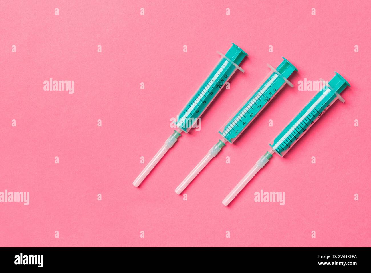 Top view of different syringes for injection on colorful background ...