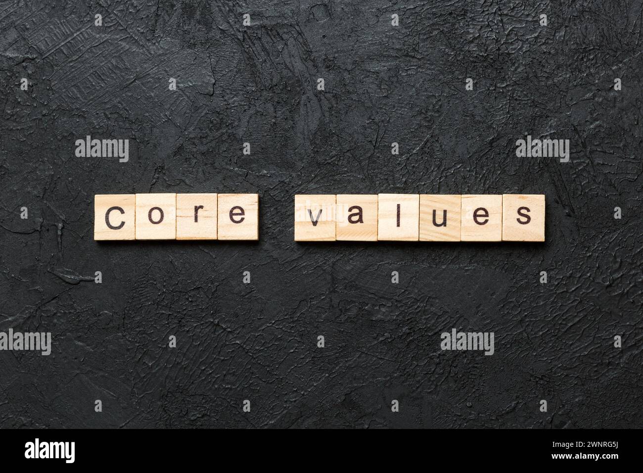 CORE VALUES word written on wood block. CORE VALUES text on cement ...