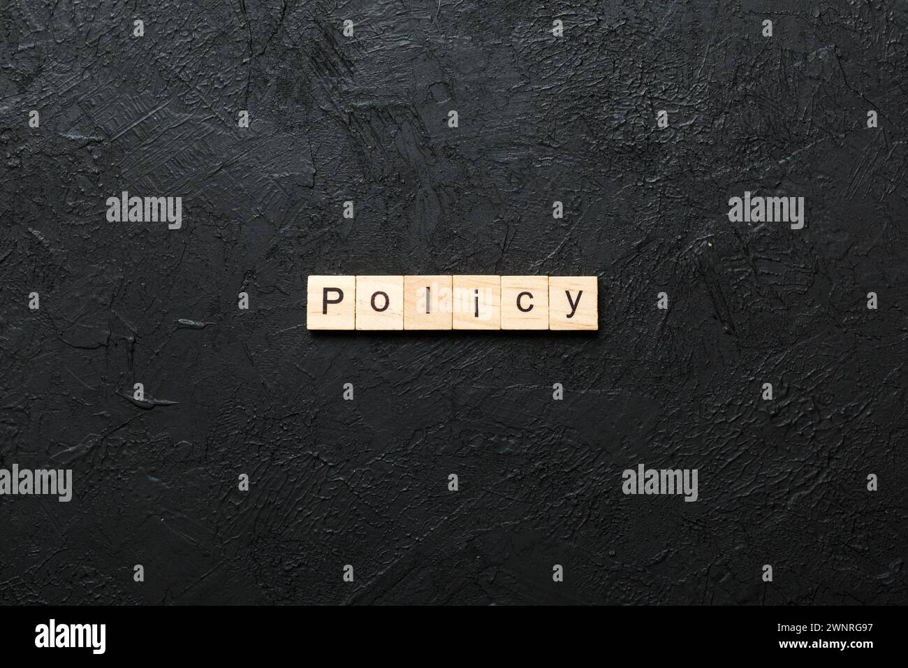 Policy word written on wood block. Policy text on cement table for your ...