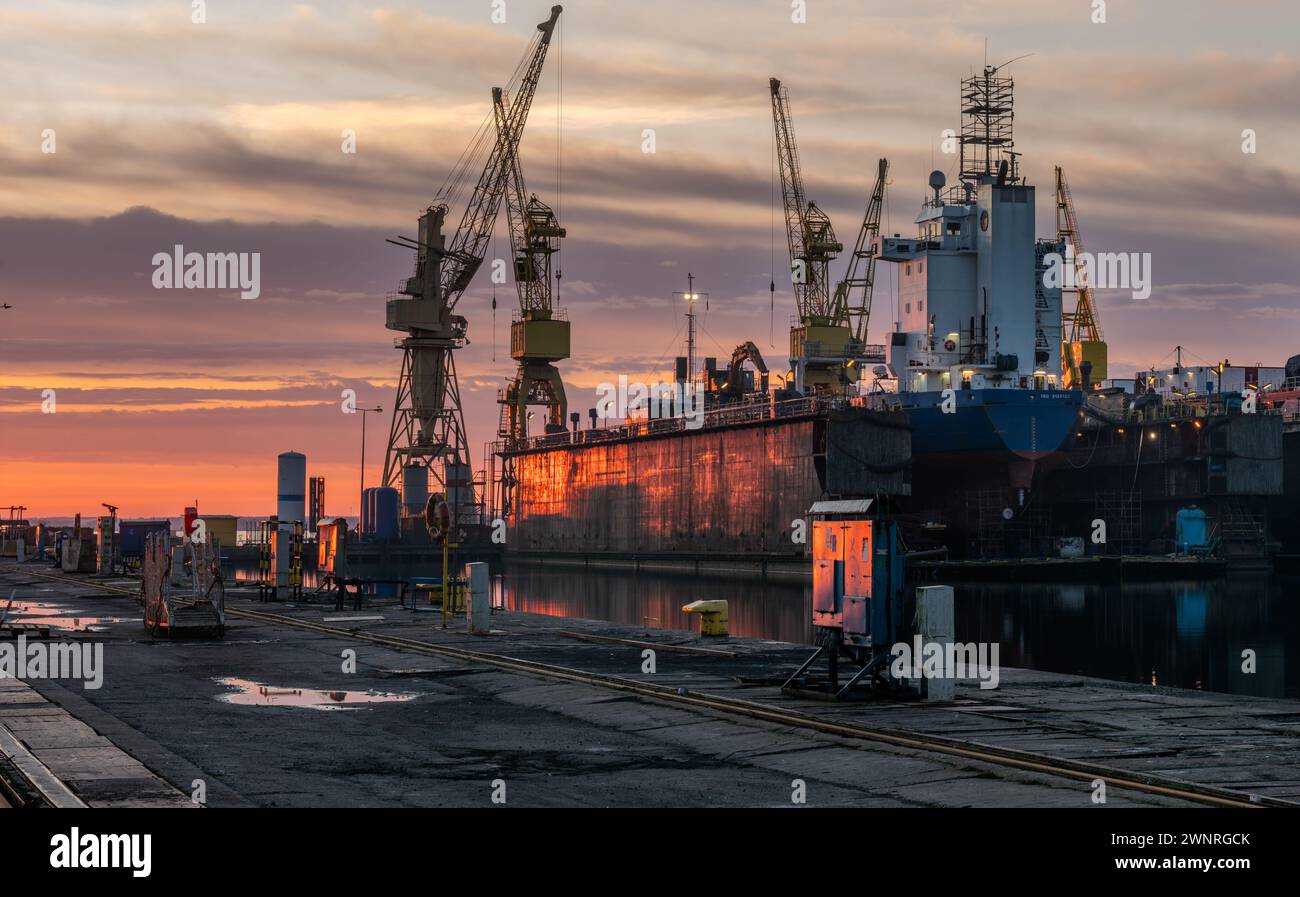 Ship repair at the ship repair yard during a spectacular sunrise Stock ...
