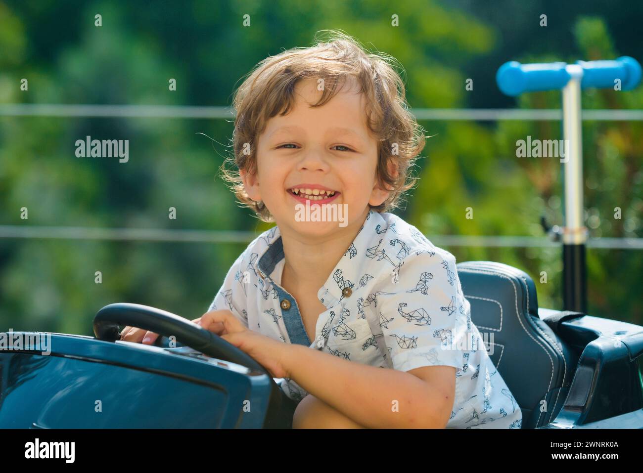 Child Driver. Cute little baby boy pretending to drive. Kid in car with ...