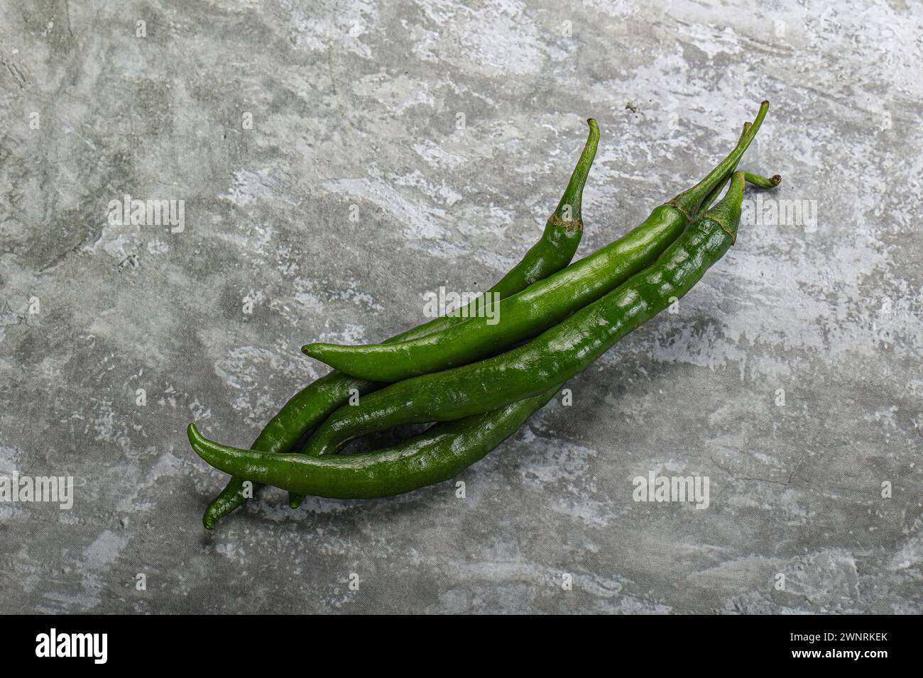Hot and spicy green chili pepper heap Stock Photo - Alamy