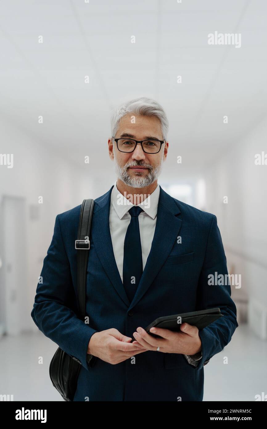 Portrait of pharmaceutical sales representative in medical building ...