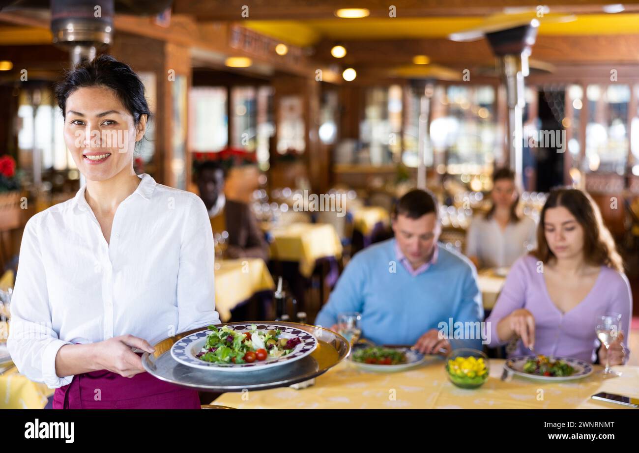 Thai waitress serving food hi-res stock photography and images - Alamy