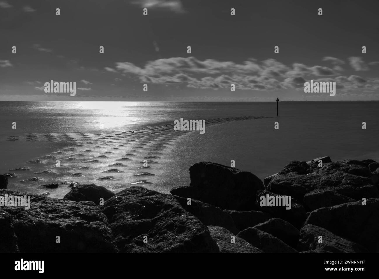 Concrete Groynes known locally as Cobbolds Point curving out into the ...