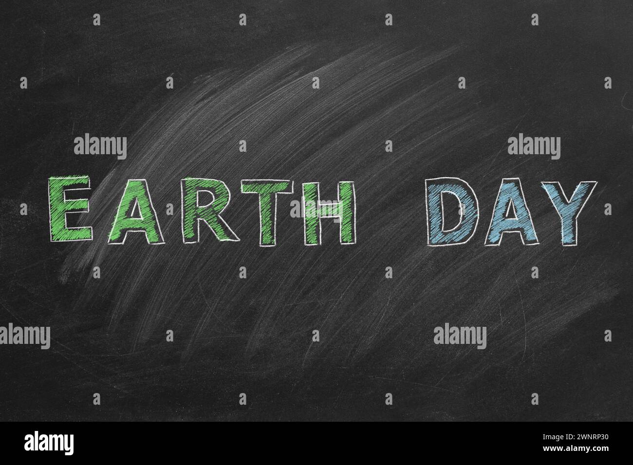 Lettering EARTH DAY hand drawn in chalk on a school blackboard Stock ...