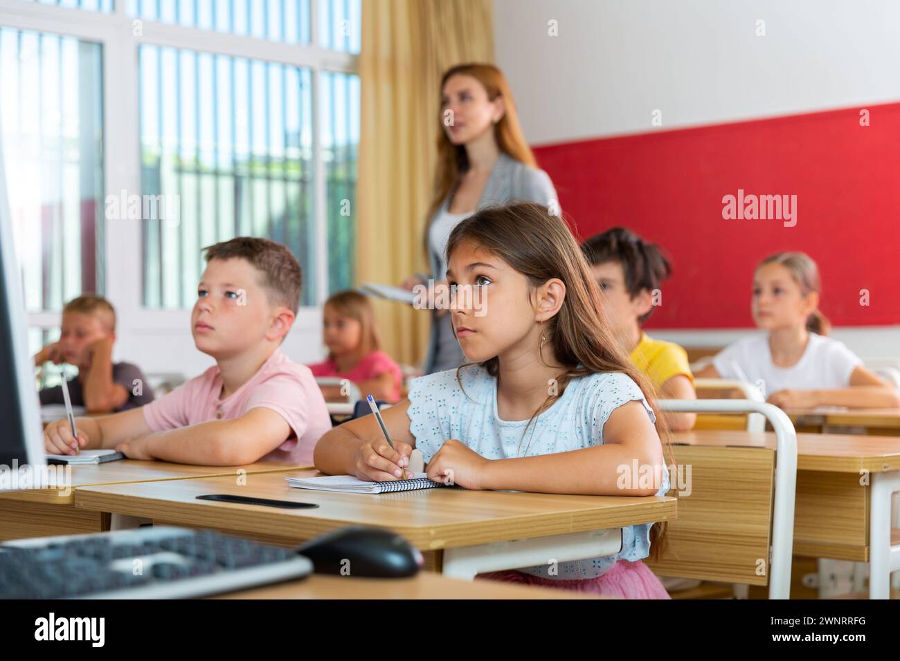Kids studying in classroom Stock Photo - Alamy