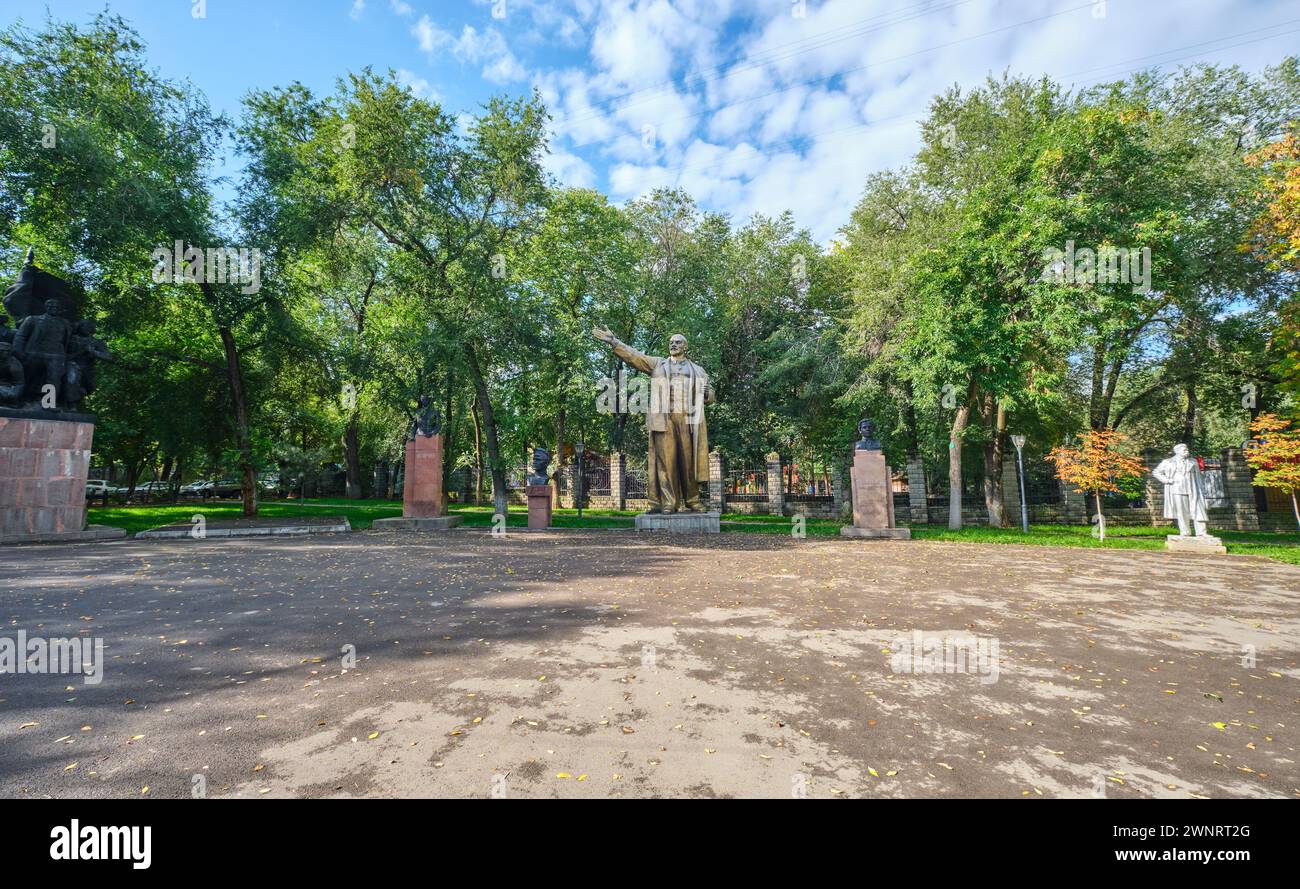 View of the large, gold painted statue of Vladimir Lenin, his right arm ...