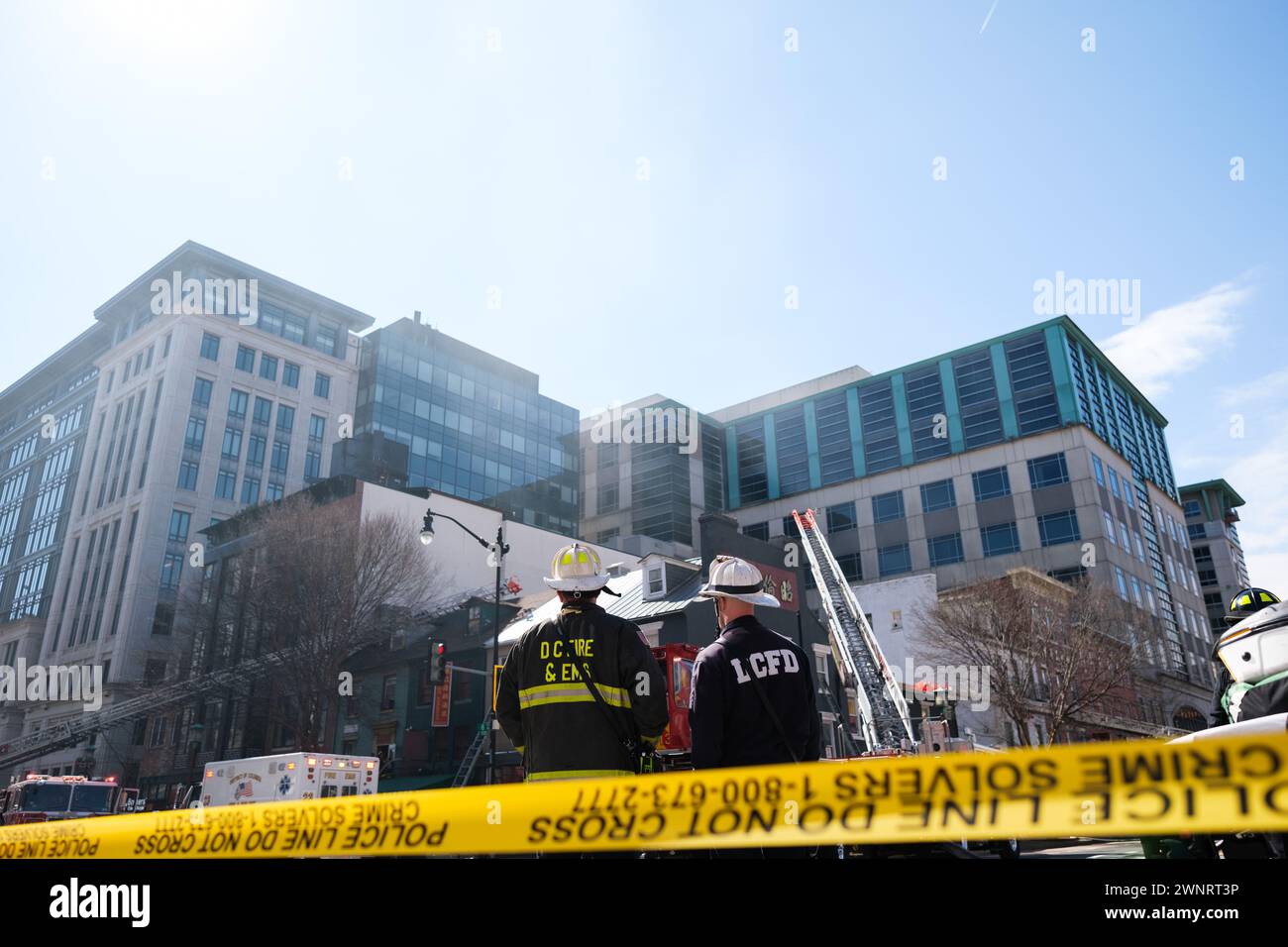 Washington, United States. 03rd Mar, 2024. Two DC Firefighters watch on ...