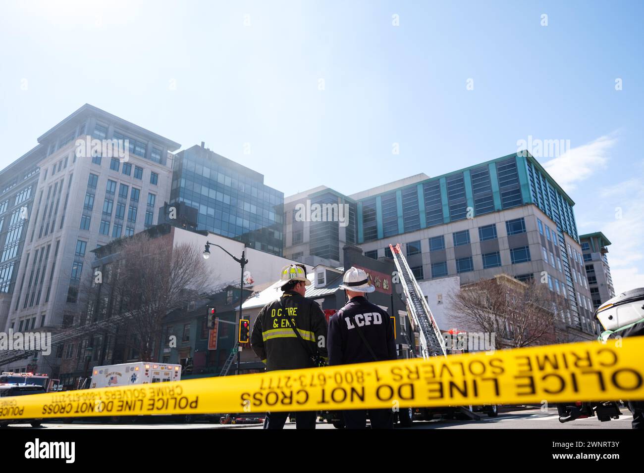 Washington, United States. 03rd Mar, 2024. Two DC Firefighters watch on ...