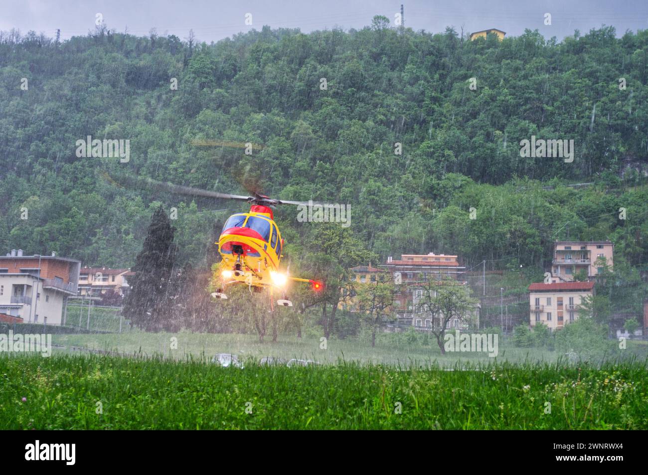 Helicopter emergency medical service taking off from a hospital helipad ...