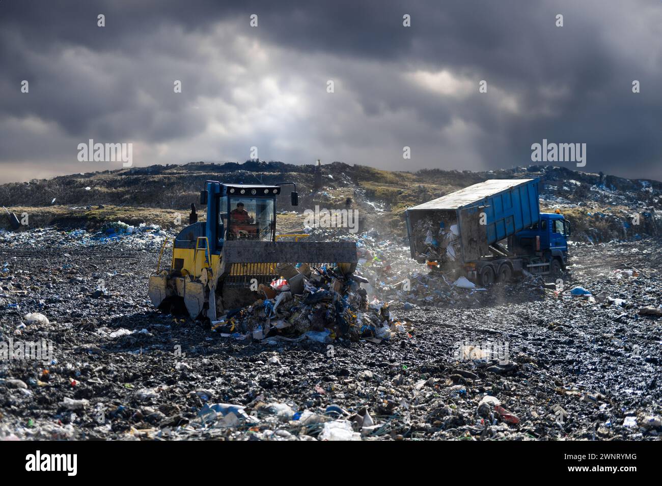 Garbage truck unloading waste on landfill, environmental concept Stock ...