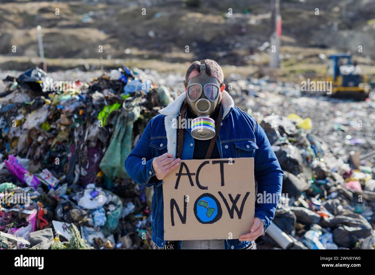 Man with gas mask holding placard, protest sign, standing standing on ...