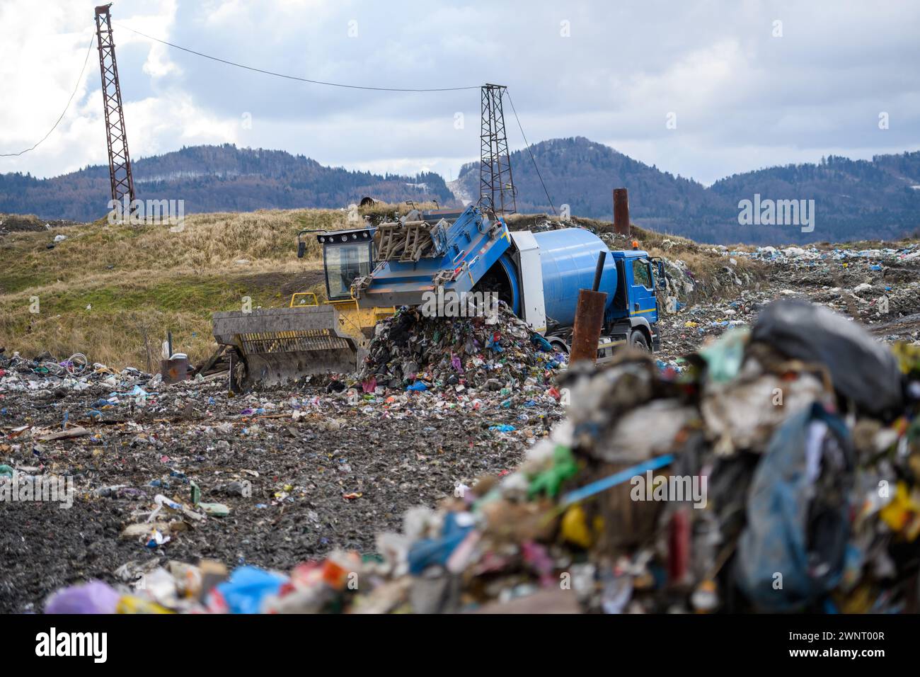 Garbage truck unloading waste on landfill, environmental concept Stock ...