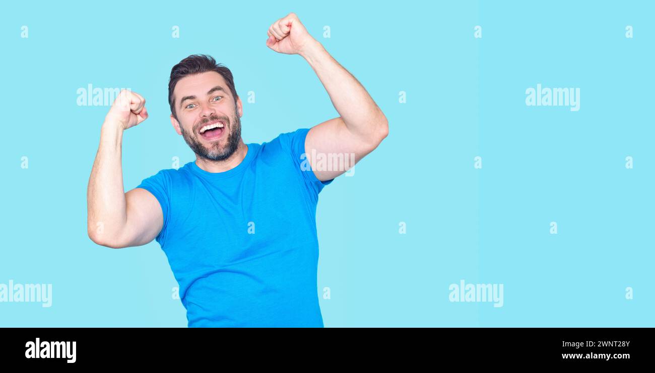 The winner. Successful man raising arms. Excited man with arms up ...