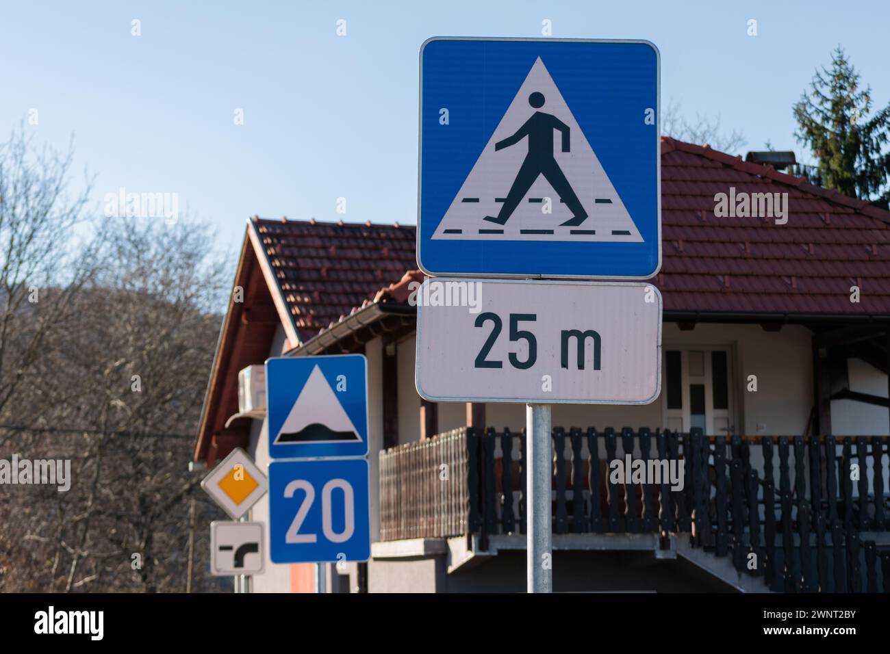 Pedestrian crossing sign with supplementary plate, traffic signs close ...