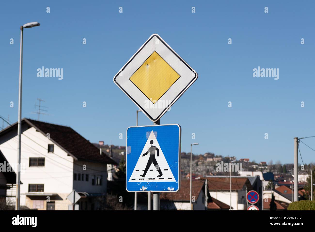 Right of way and pedestrian crossing or crosswalk traffic sign close up ...