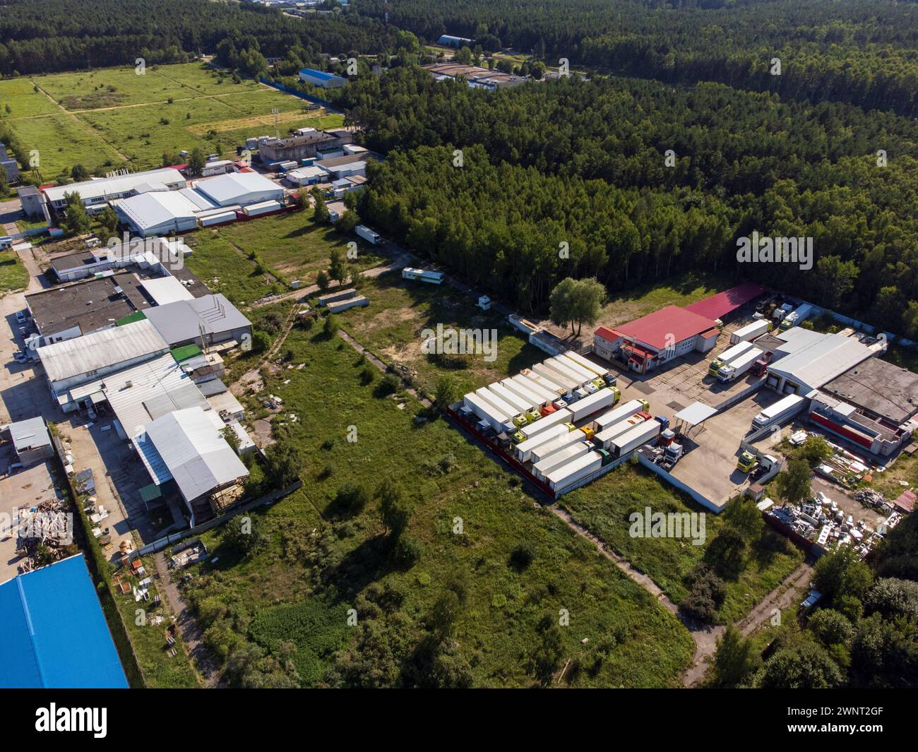 An aerial shot captures the sprawling expanse of an industrial factory ...