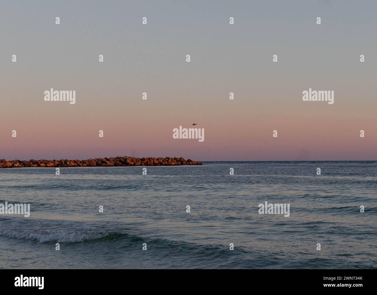Orange Beach Jetty at Sunset Stock Photo - Alamy