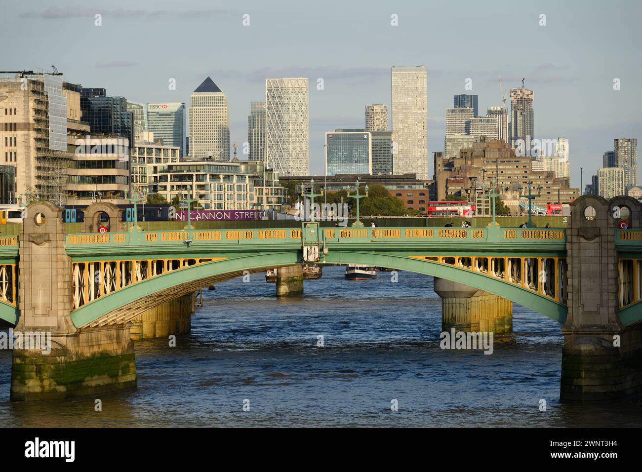View of Southwark Bridge over River Thames with Canary Wharf ...