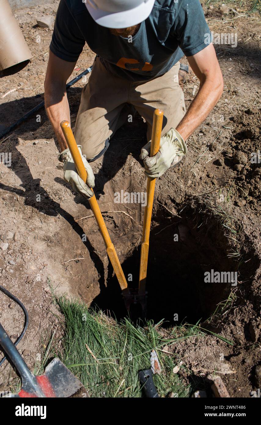 Close-up of manual post hole digging Stock Photo - Alamy