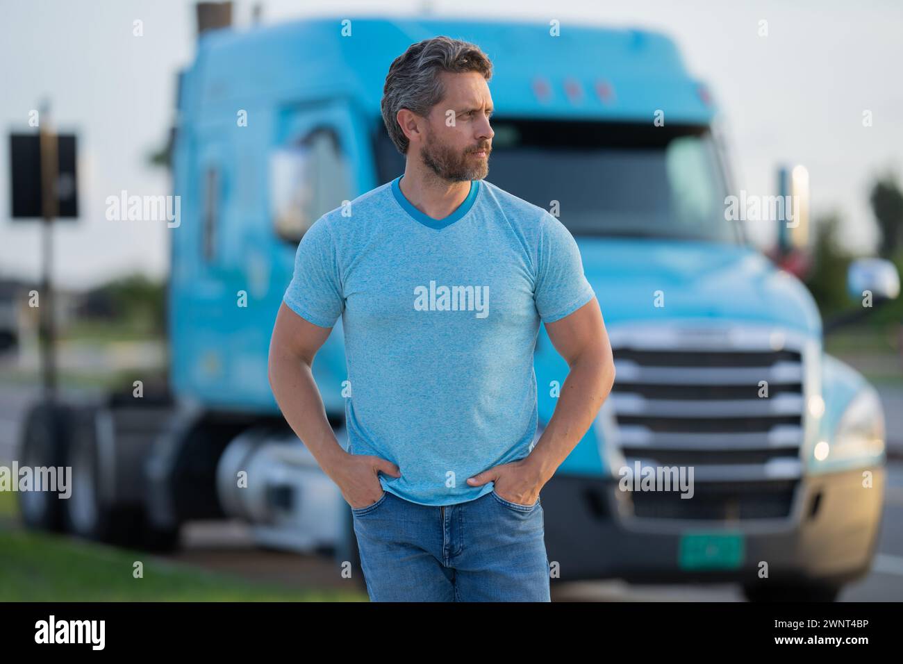 Men driver near lorry truck. Truck driver in safety vest near truck ...