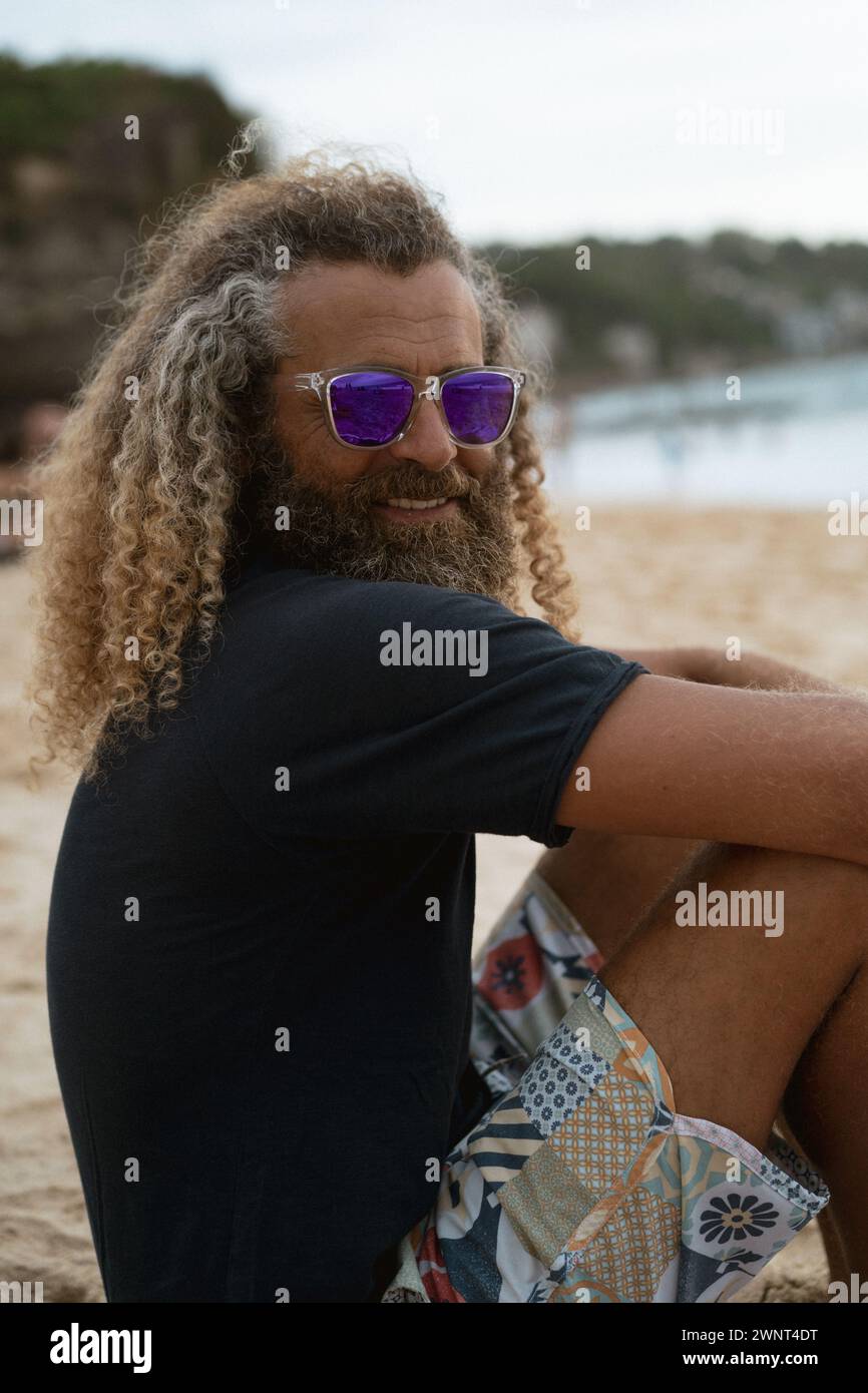 Stylish arab man, long curly hair, purple sunglasses, emotional Stock ...
