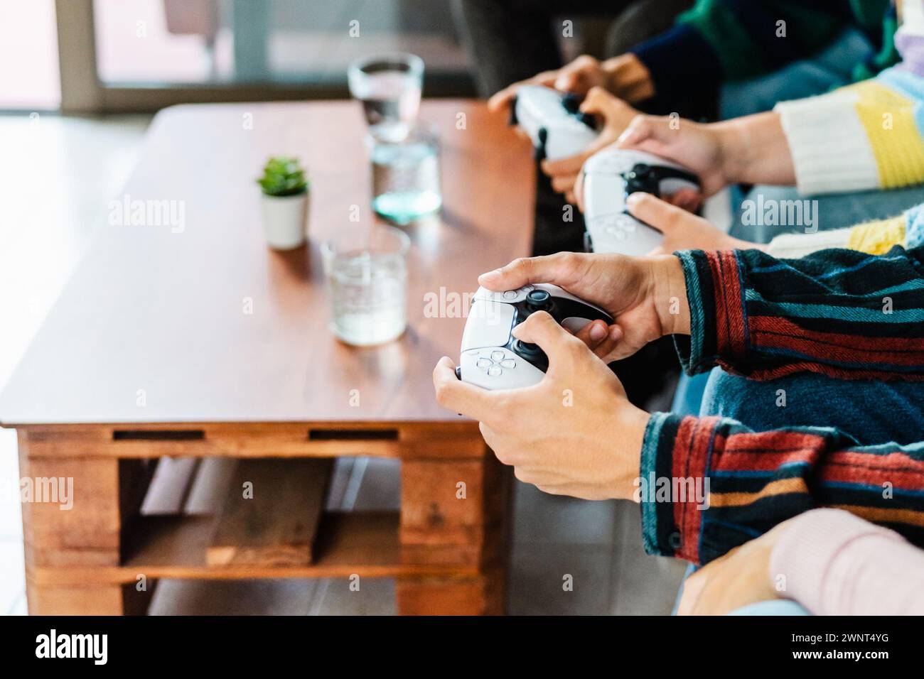 Young gamers playing online video game console at home - Youth people ...