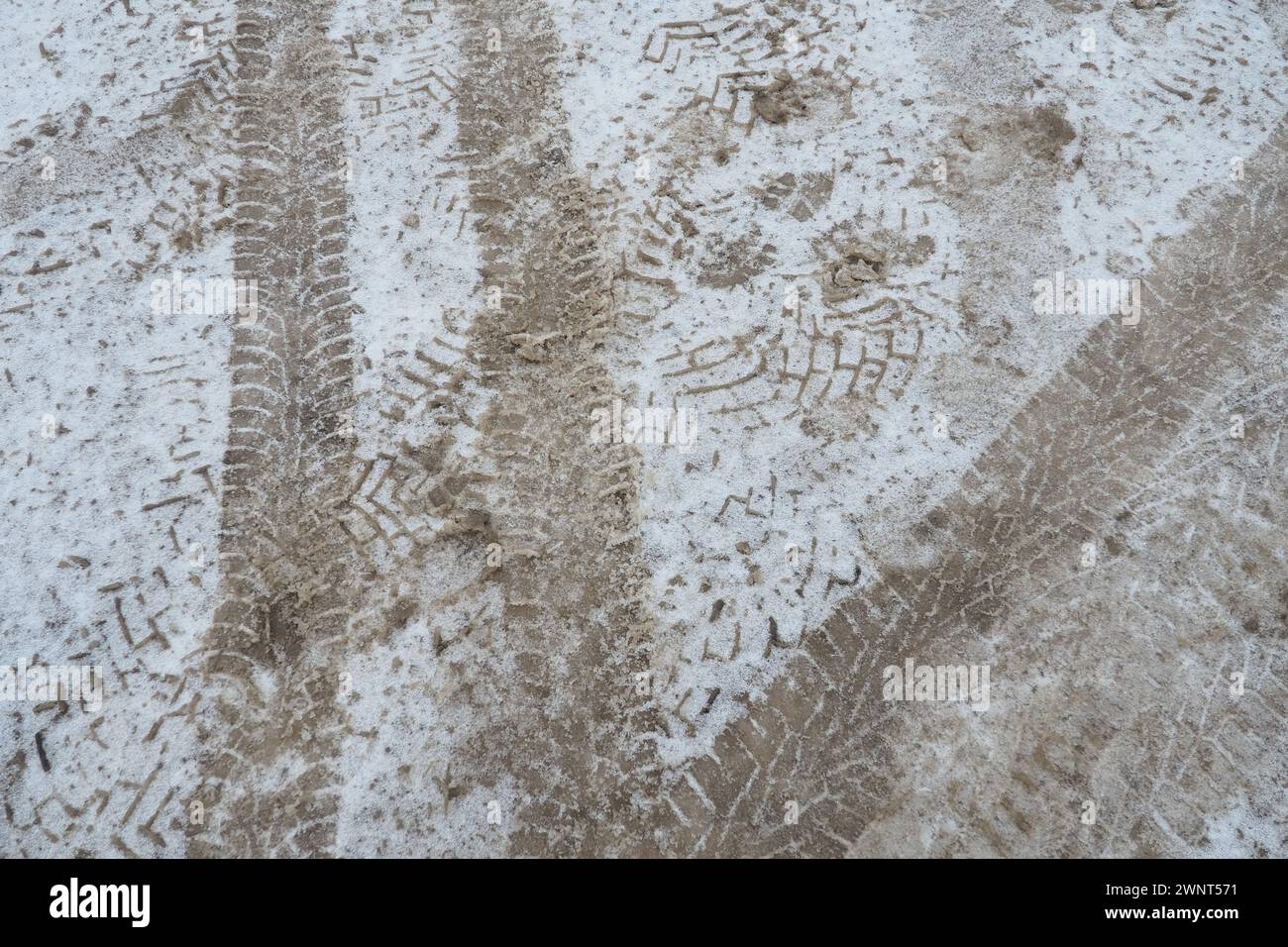 Snow, ice, slush and winter mud at a pedestrian crossing. The air ...