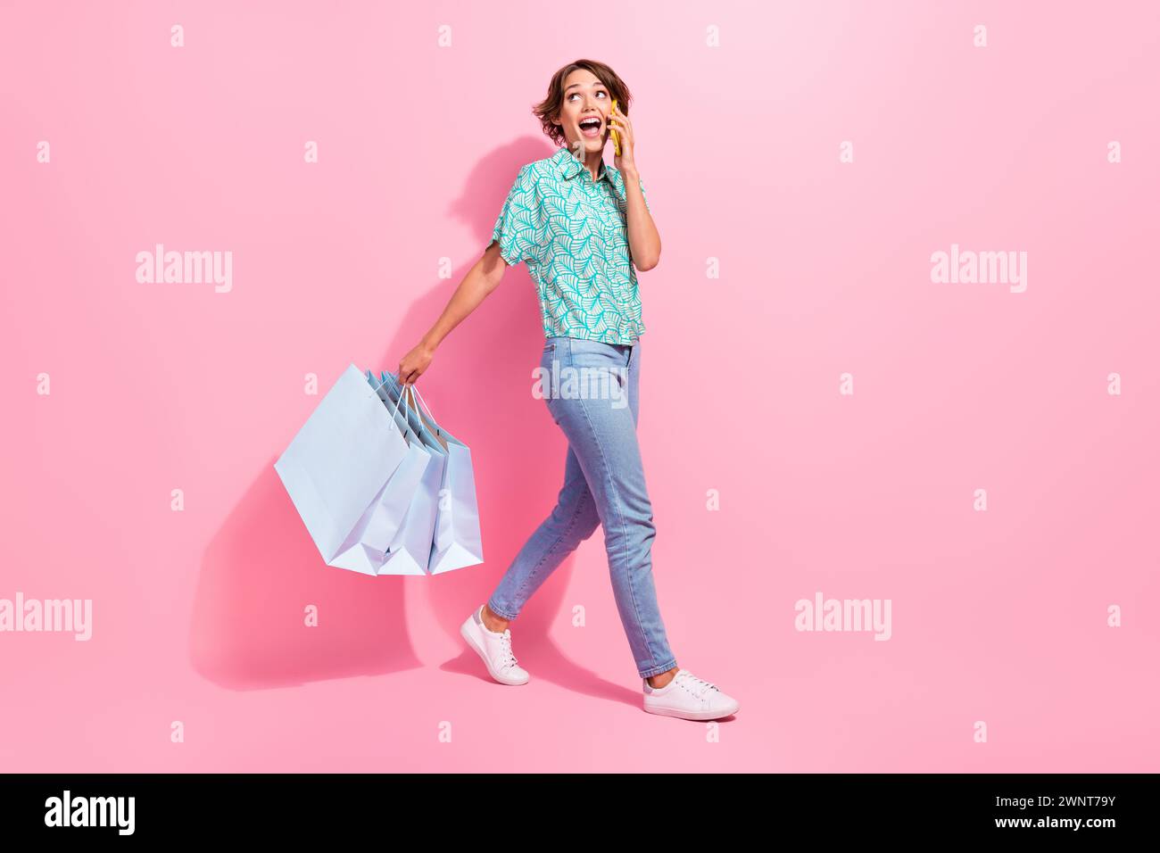 Full length profile portrait of excited charming person walk speak ...