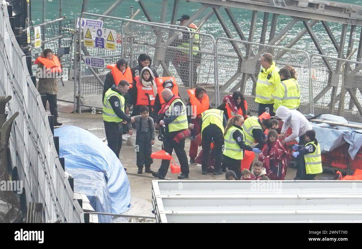 A group of people thought to be migrants are brought in to Dover, Kent ...