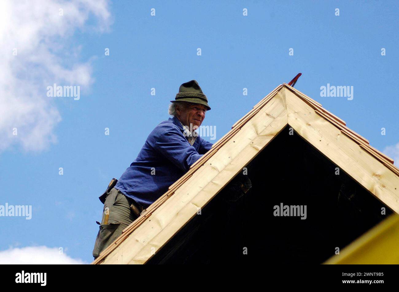 wooden roof shingles on a house, construction with natural materials ...