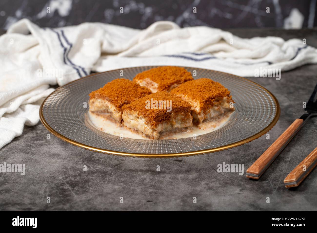 Cold baklava with biscuits. Cold baklava with biscuit filling on a dark ...