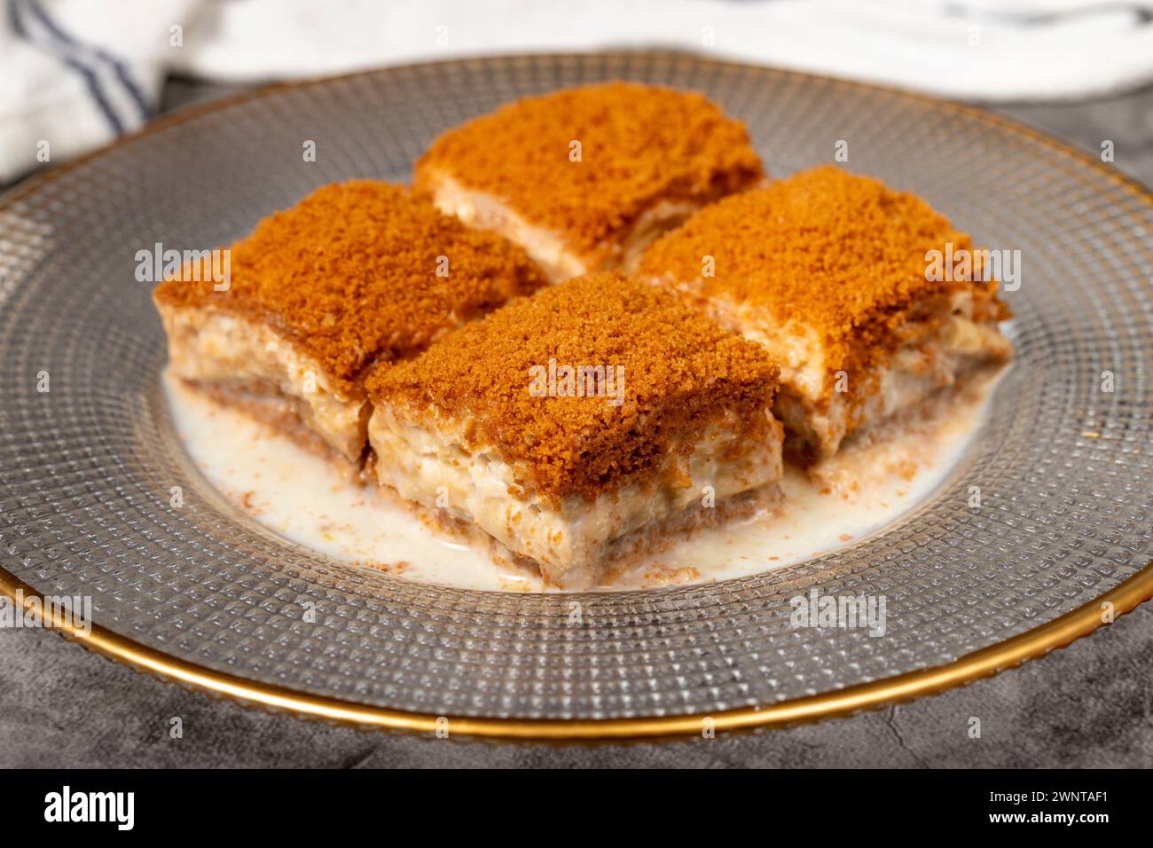 Cold baklava with biscuits. Cold baklava with biscuit filling on a dark ...