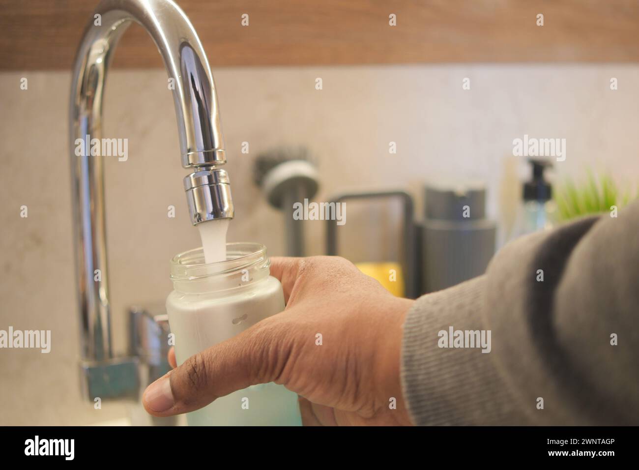 Tap water pouring from bottle hi-res stock photography and images - Alamy