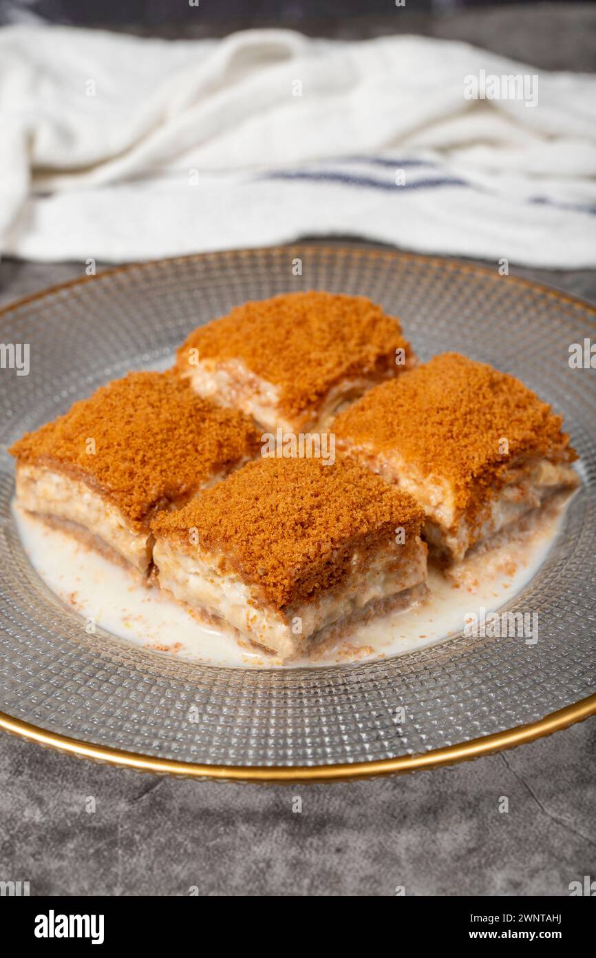 Cold baklava with biscuits. Cold baklava with biscuit filling on a dark ...