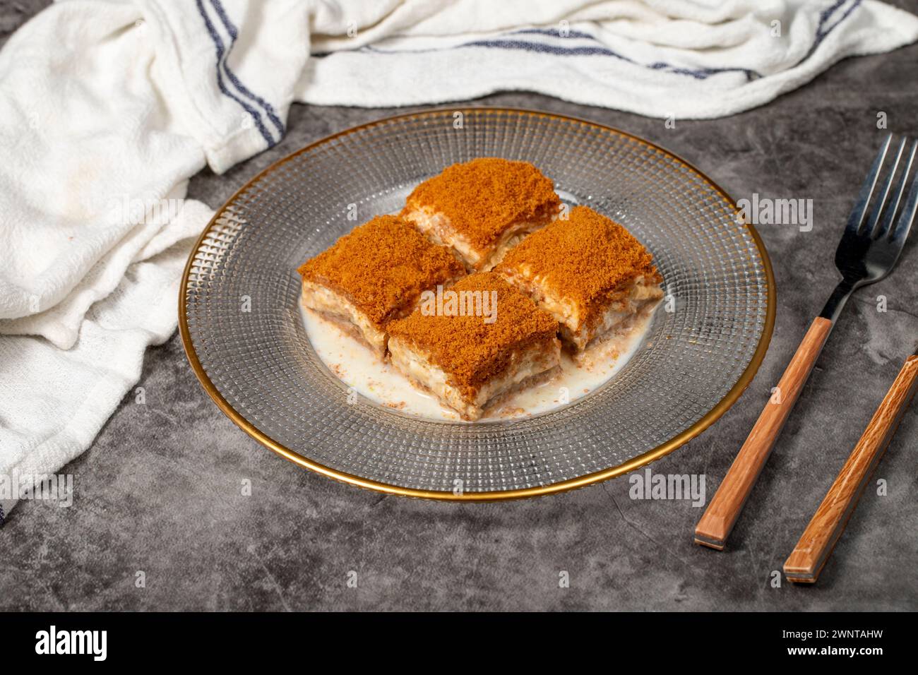 Cold baklava with biscuits. Cold baklava with biscuit filling on a dark ...