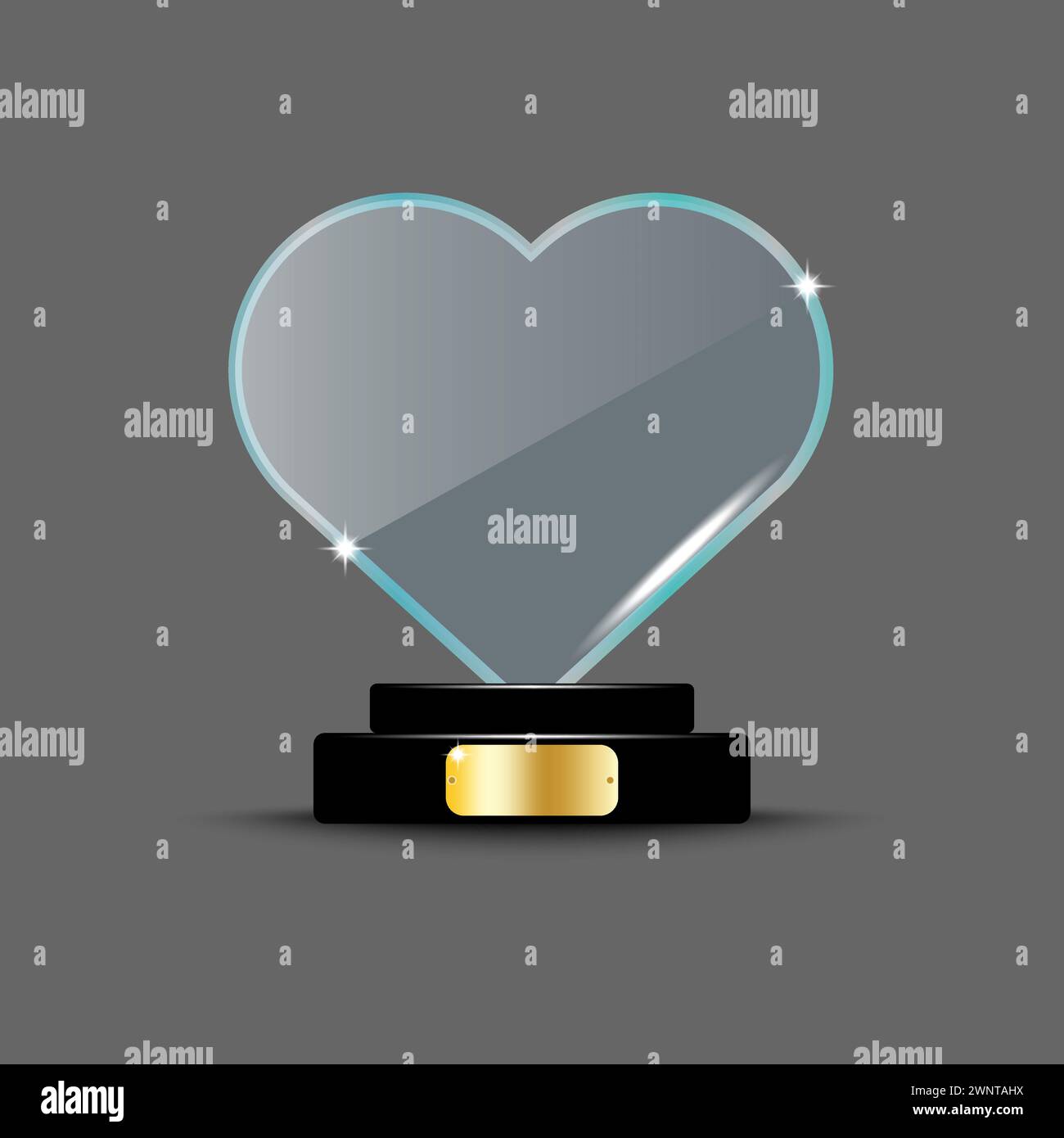 Glass award, trophy in the form of a heart. Glass heart on a stand ...