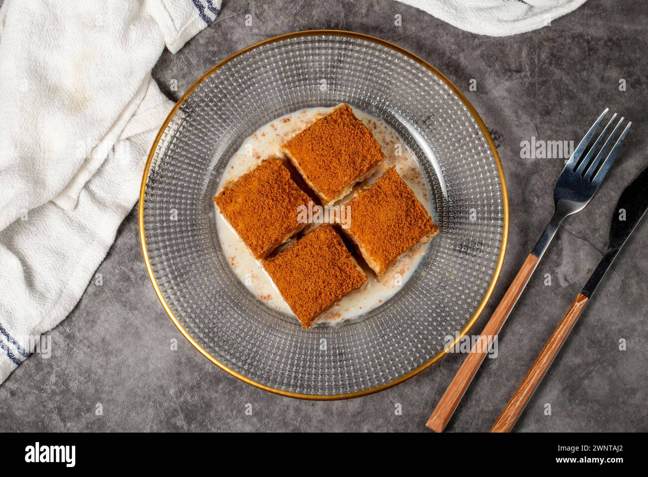 Cold baklava with biscuits. Cold baklava with biscuit filling on a dark ...