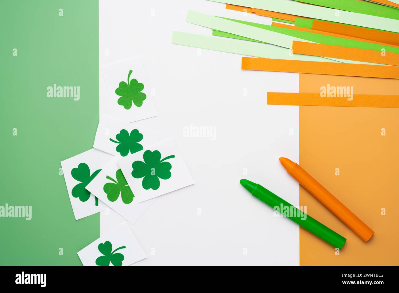Irish flag made from color paper with cut out shamrock clover and ...
