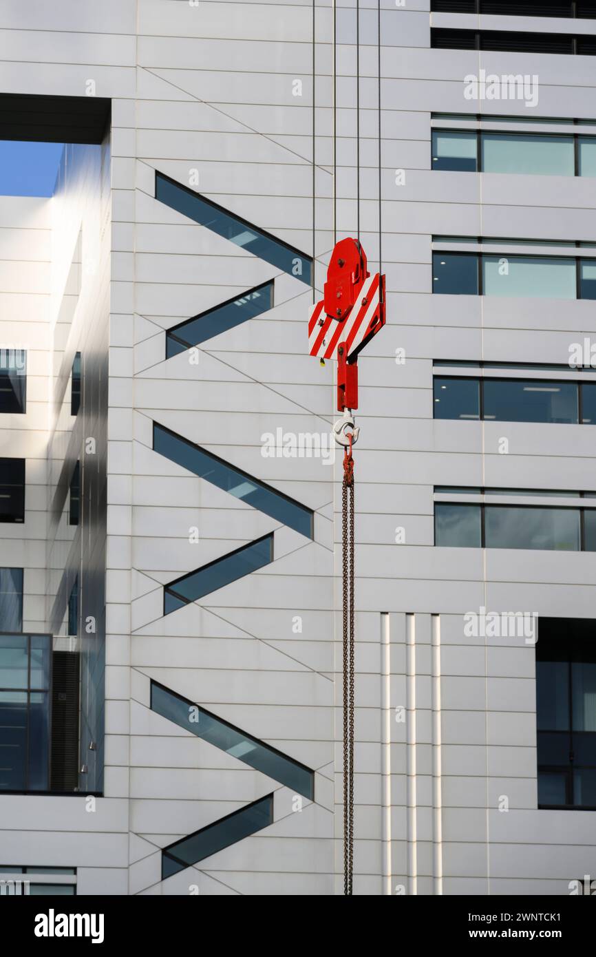 The hook block of a tower crane working on the redevelopment of ...
