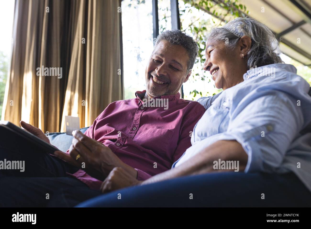 Elderly woman comfortably seated hi-res stock photography and images - Alamy